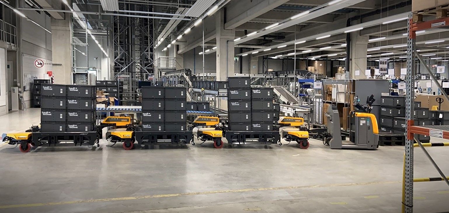 Efficient warehousing pulled by a tugger train system